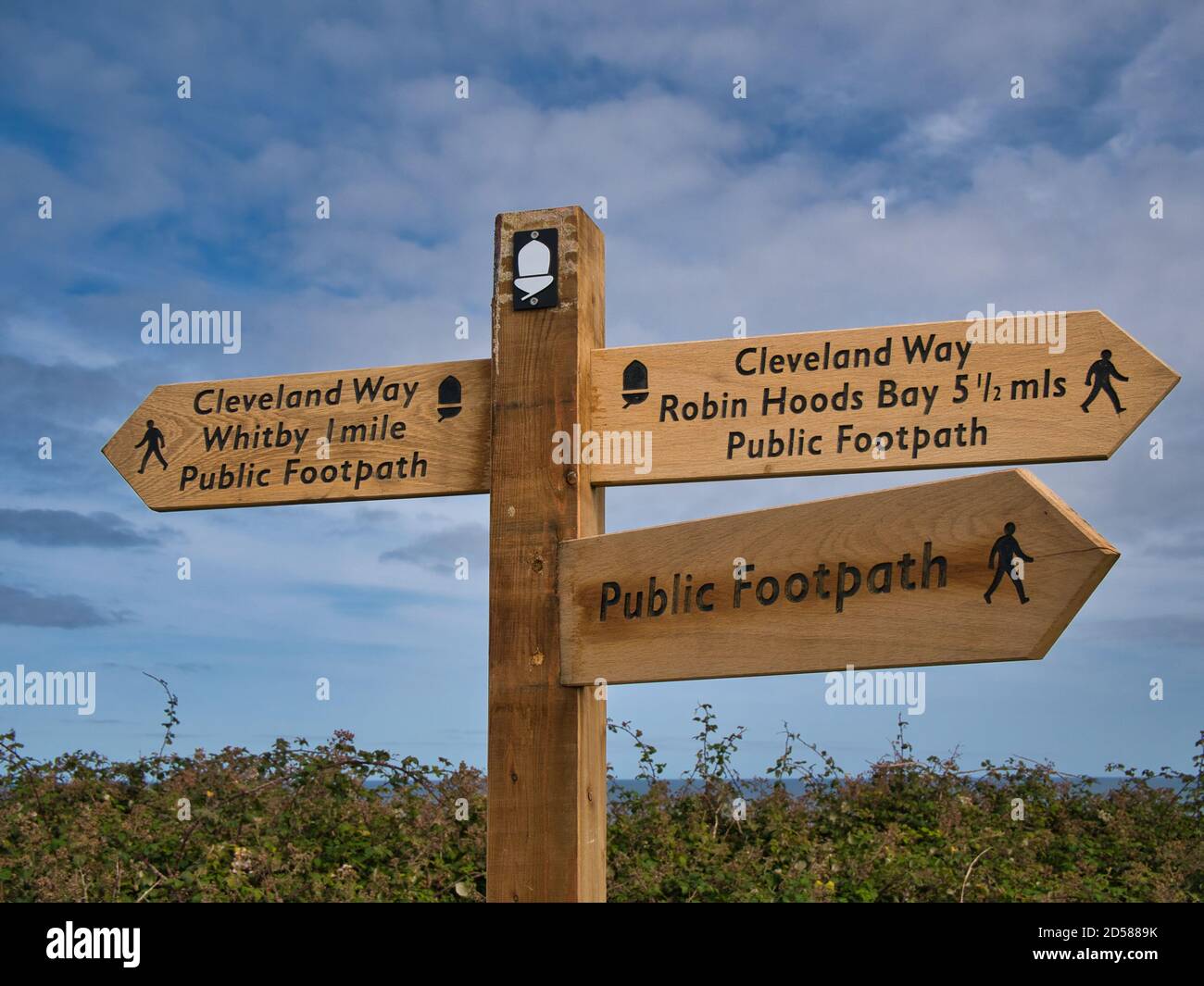 A wooden signpost on a coastal section of the Cleveland Way national ...