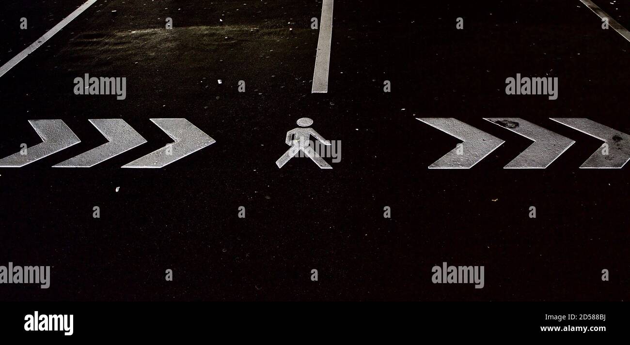 Painted pictogram of walking man with arrows left and right Stock Photo ...