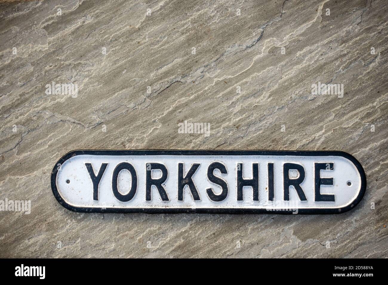 Yorkshire metal street name sign on Yorkshire stone Stock Photo - Alamy