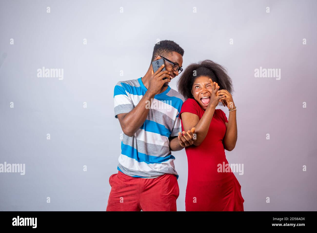 fun and exciting young african people making phone calls Stock Photo ...