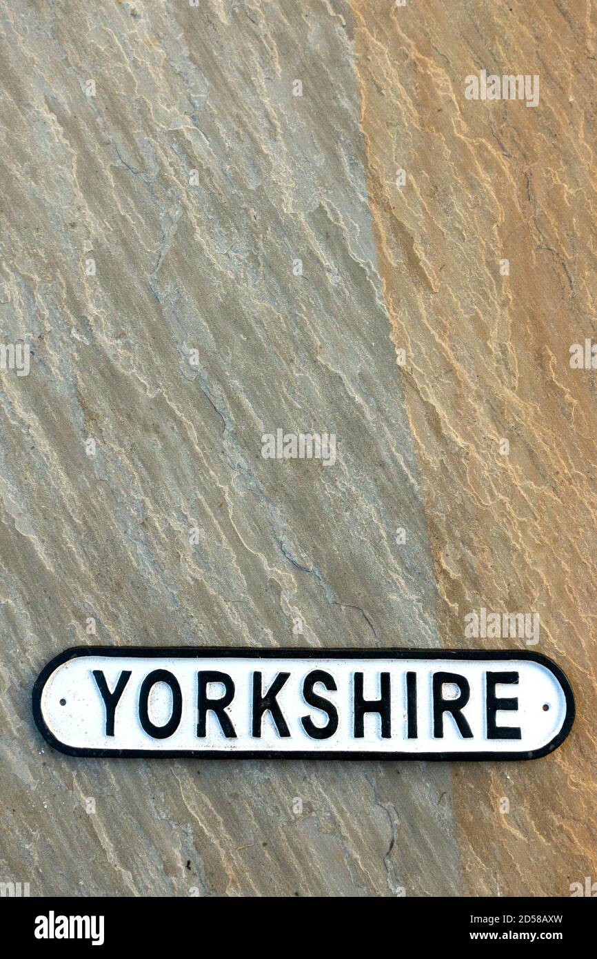 Yorkshire metal street name sign on Yorkshire stone Stock Photo - Alamy