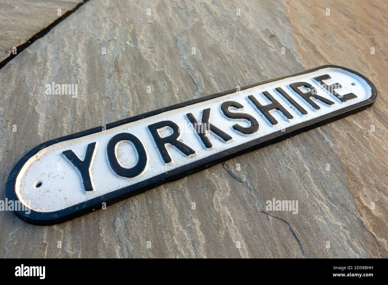 Yorkshire metal street name sign on Yorkshire stone Stock Photo - Alamy