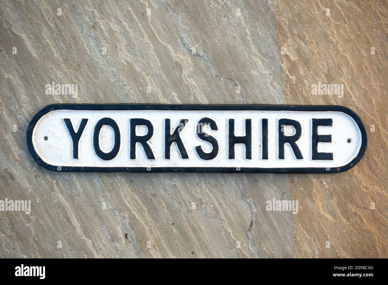Yorkshire metal street name sign on Yorkshire stone Stock Photo - Alamy