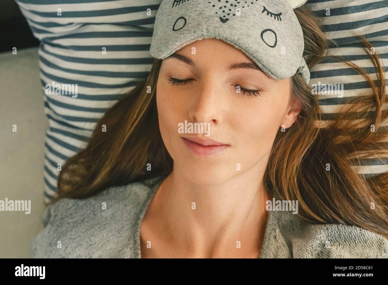 Pretty Long Hair Young Woman in Sleeping on Bed. Forehead sleep mask ...