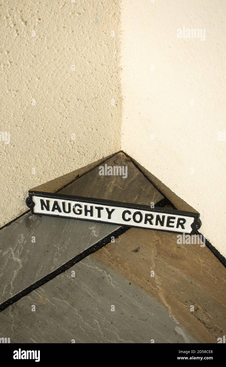 Cast vintage sign saying leaning against a corner saying Naughty Corner ...