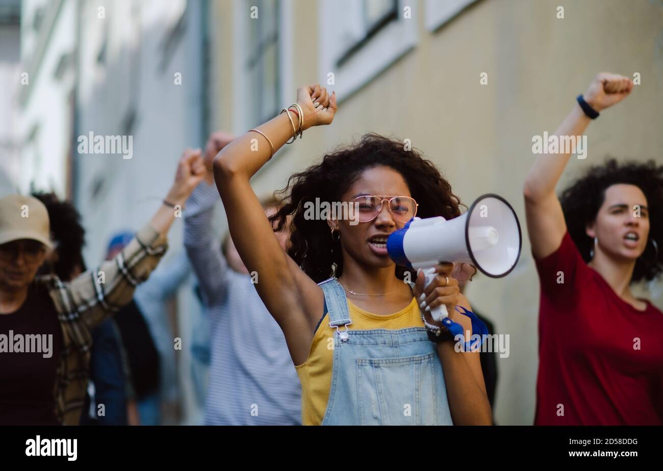 Group of people activists protesting on streets, strike and ...