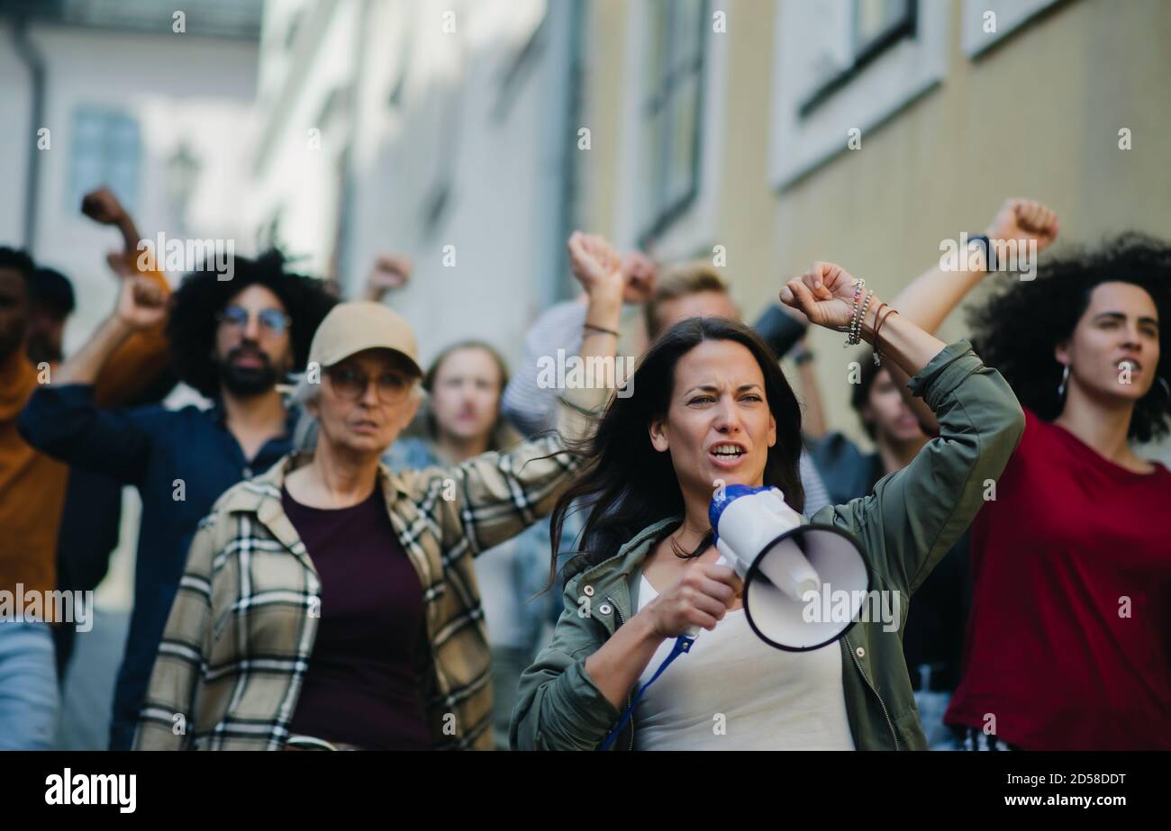 Group of people activists protesting on streets, strike and ...