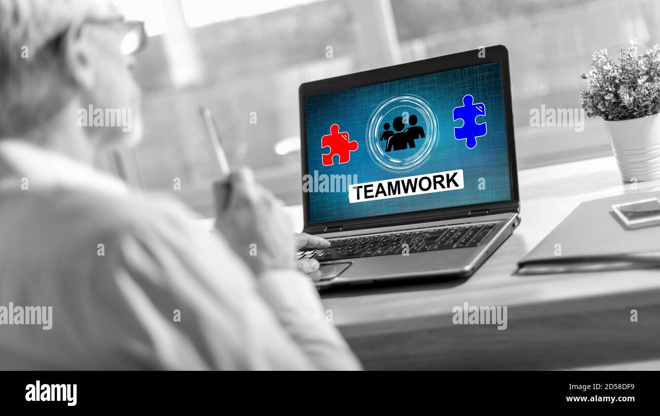 Laptop screen displaying a teamwork concept Stock Photo - Alamy