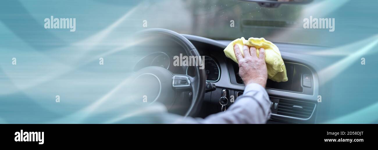 Man cleaning the dashboard of his car; panoramic banner Stock Photo - Alamy