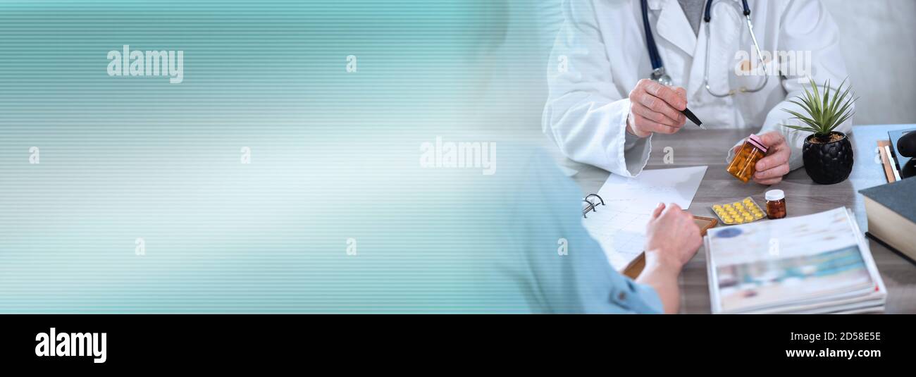 Doctor explaining medicine to his patient in medical office; panoramic ...