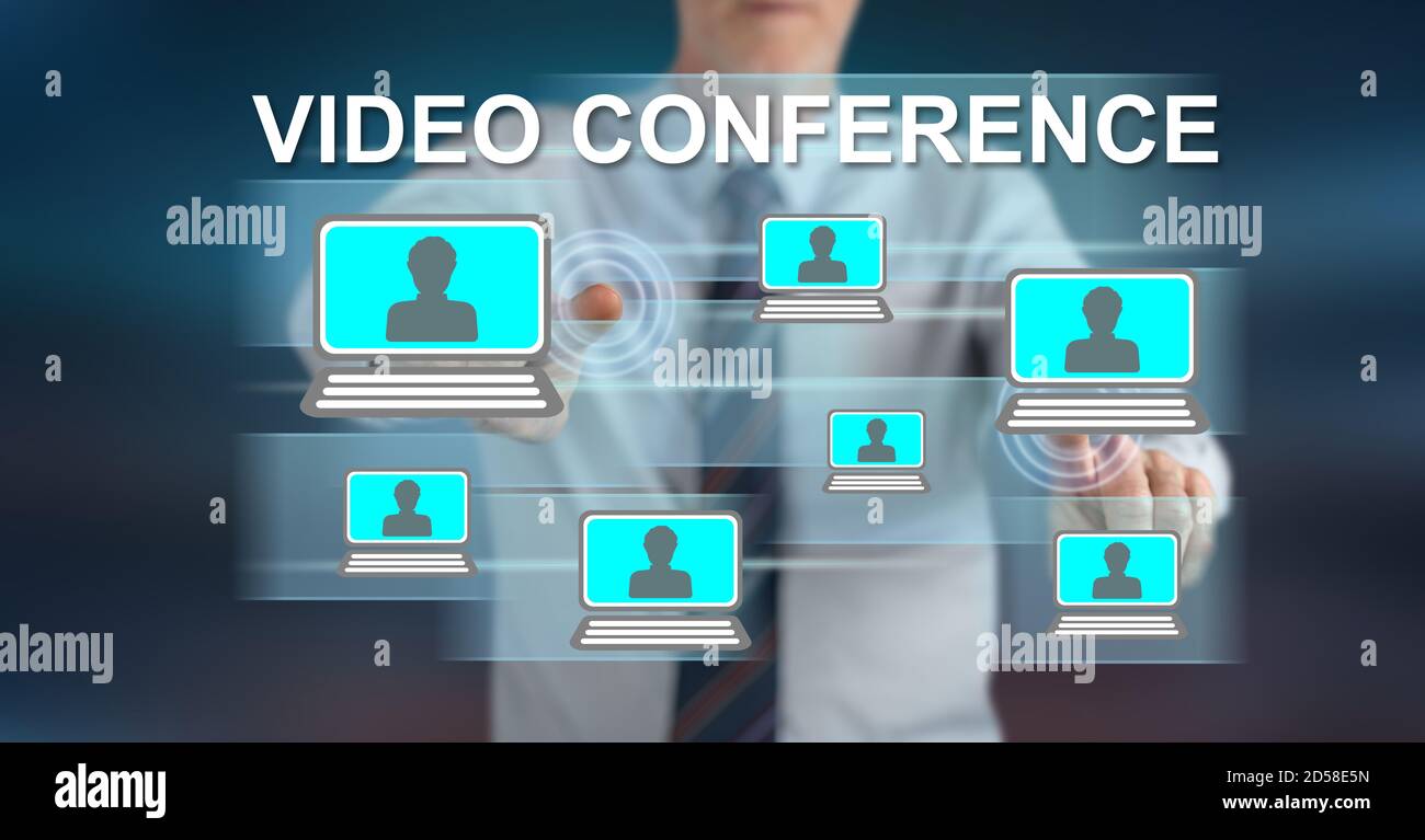 Man touching a video conference concept on a touch screen with his ...