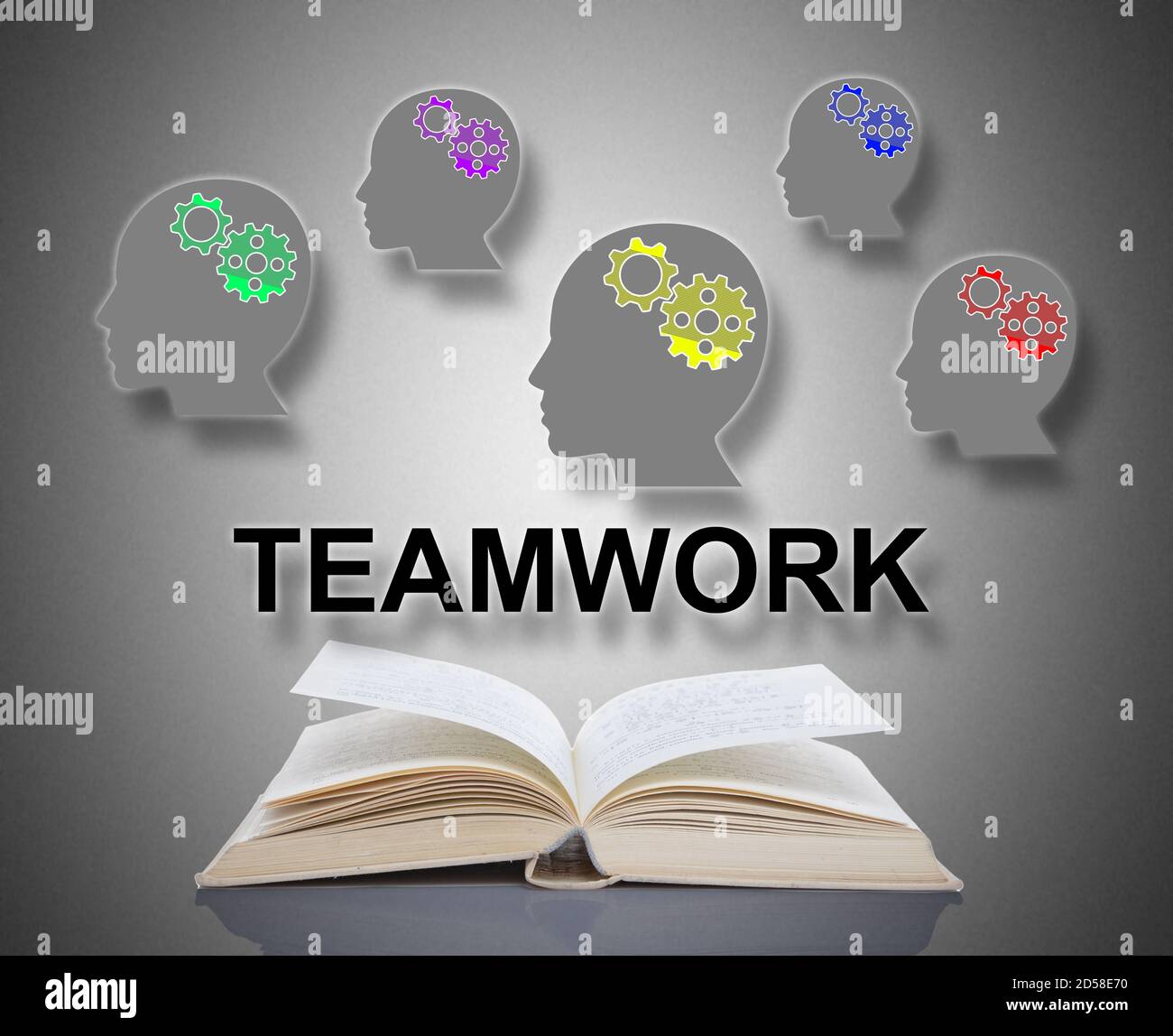 Teamwork concept above an open book Stock Photo - Alamy