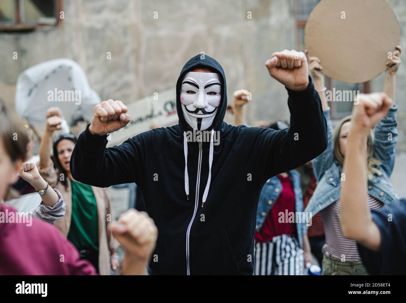 Group of people activists with face mask protesting on streets, strike ...