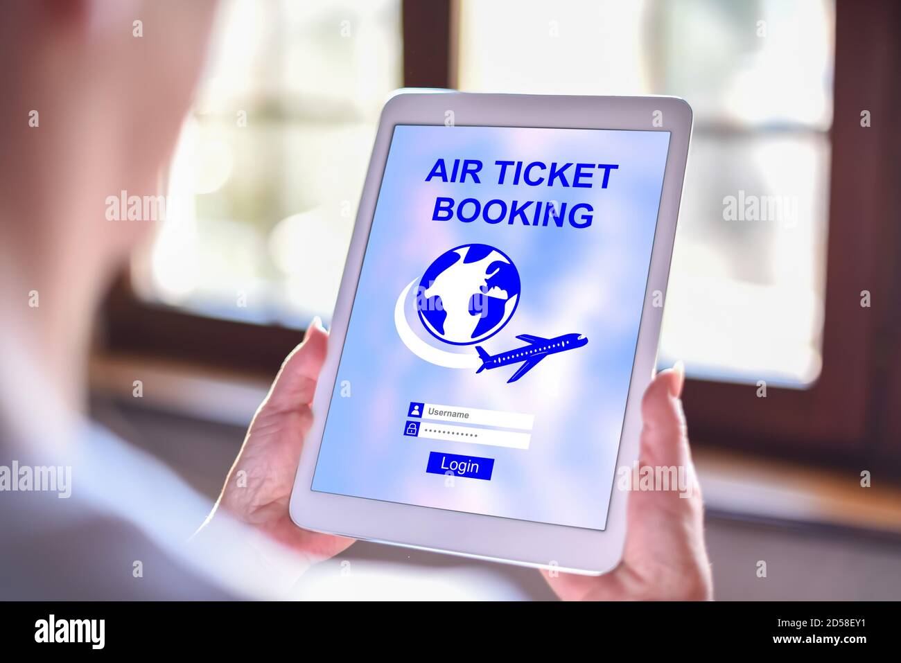 Tablet screen displaying an air ticket booking concept Stock Photo - Alamy