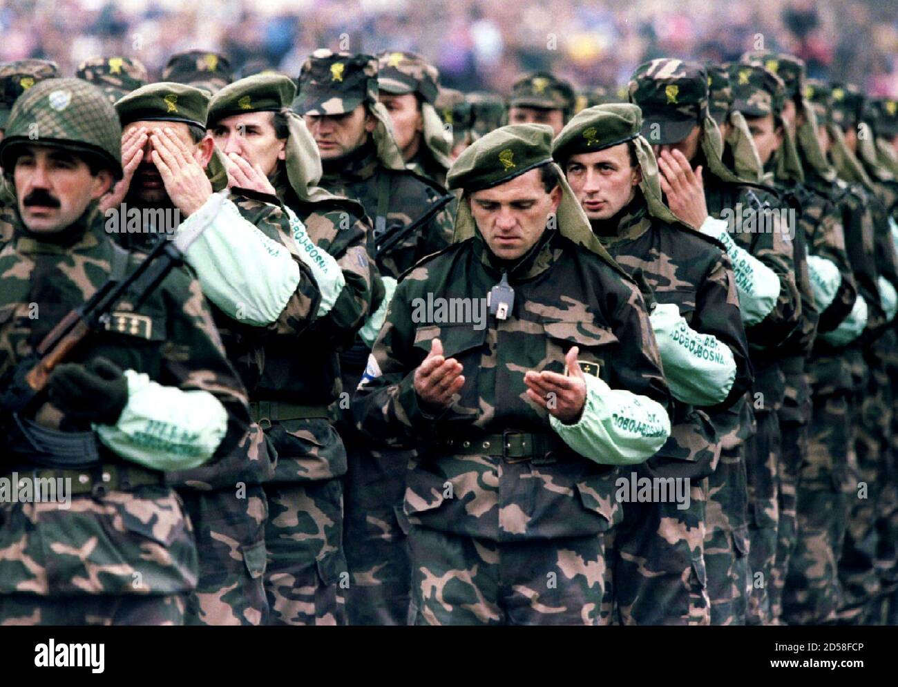 Bosnian Army soldiers pray during a Bosnian military parade in Zenica ...