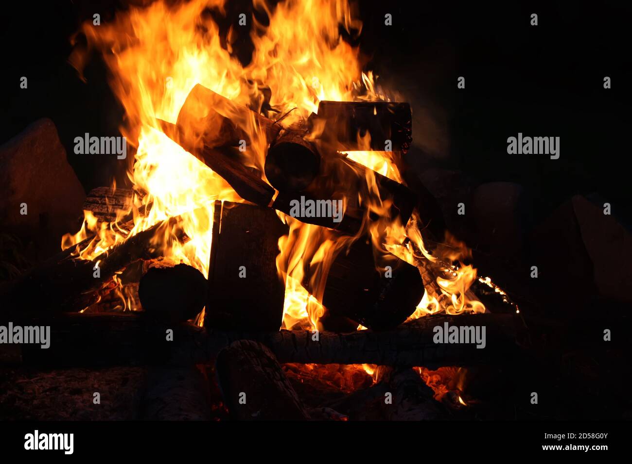Bright flame of a burning fire above the brazier outdoors Stock Photo ...