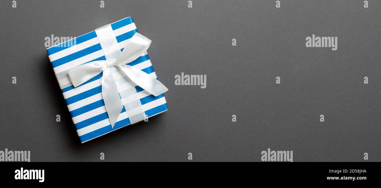 wrapped Christmas or other holiday handmade present in paper with white ...