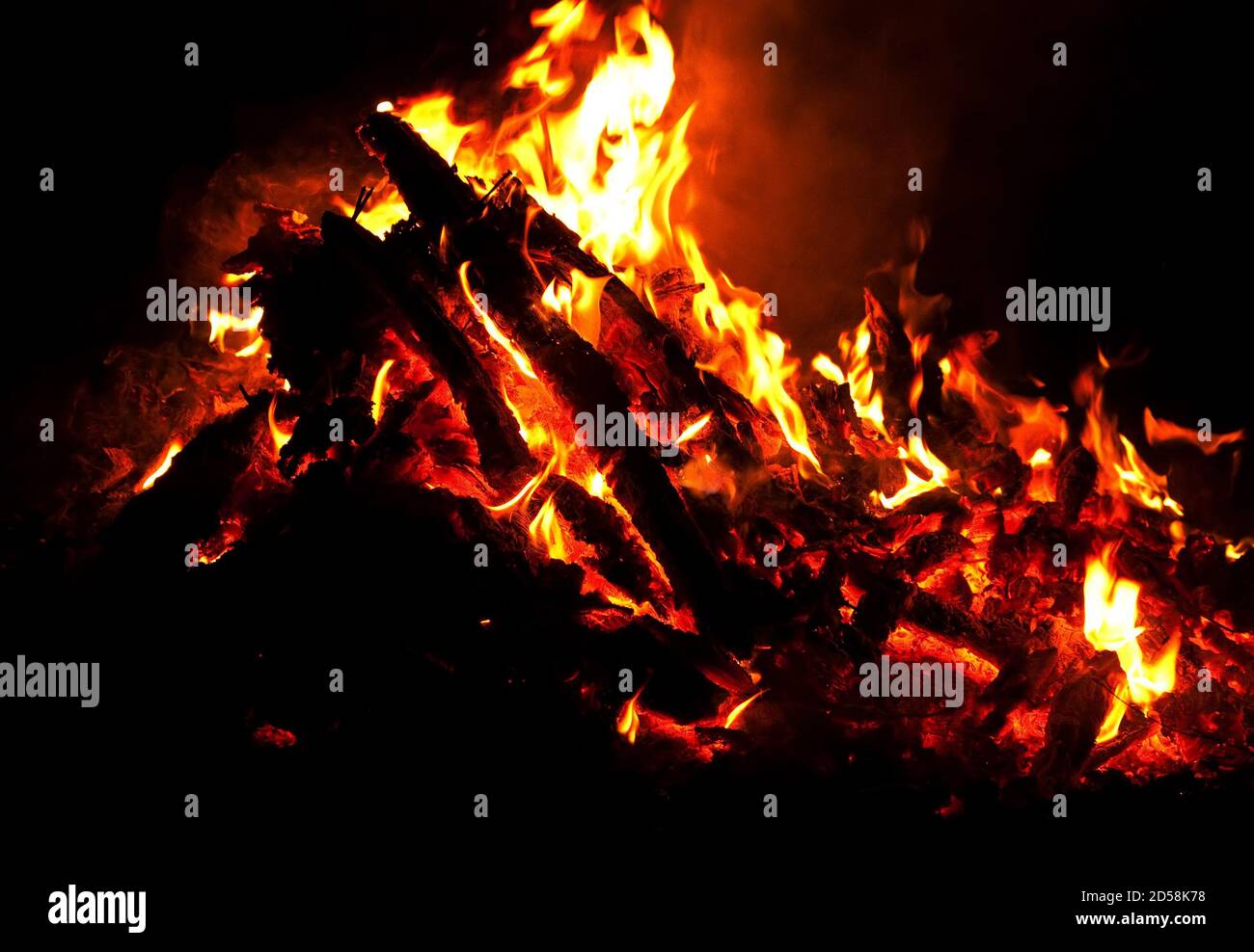 Bright flame of a burning fire above the brazier outdoors Stock Photo ...