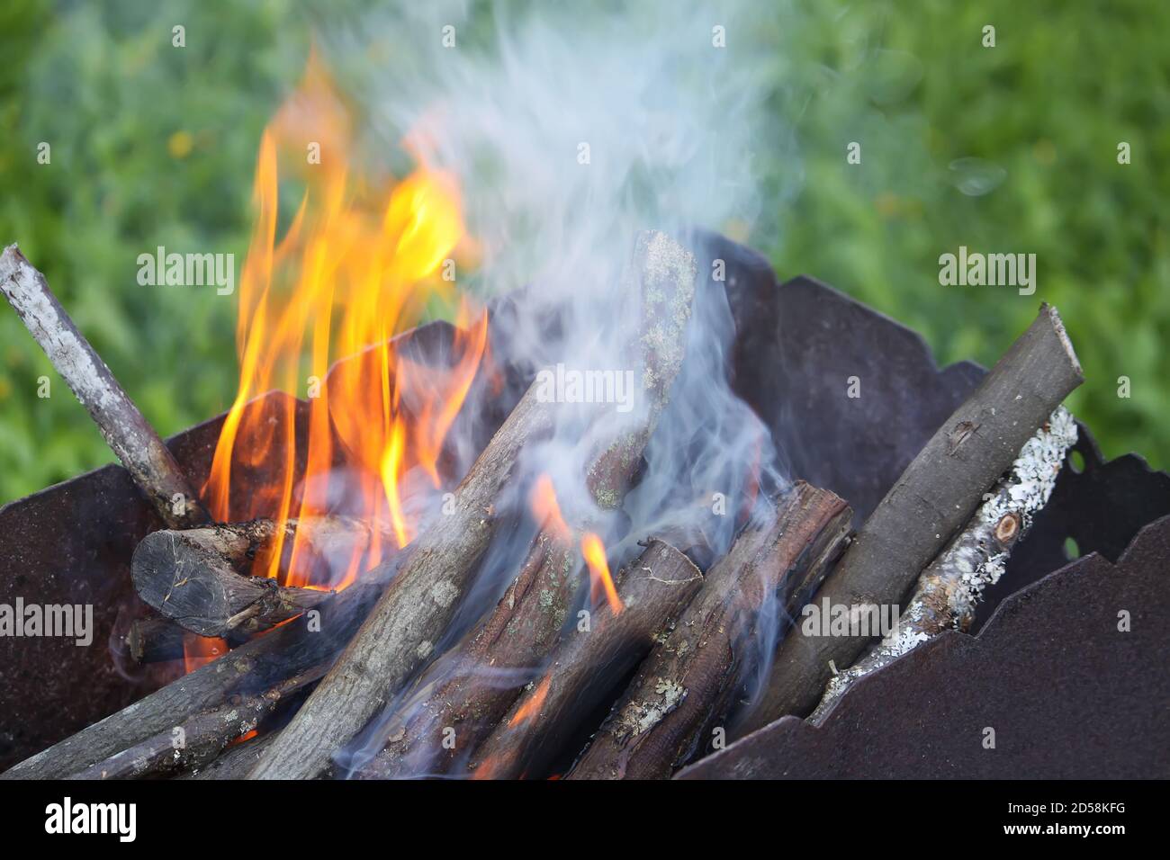 Bright bonfire flame on the rural field at evening Stock Photo - Alamy