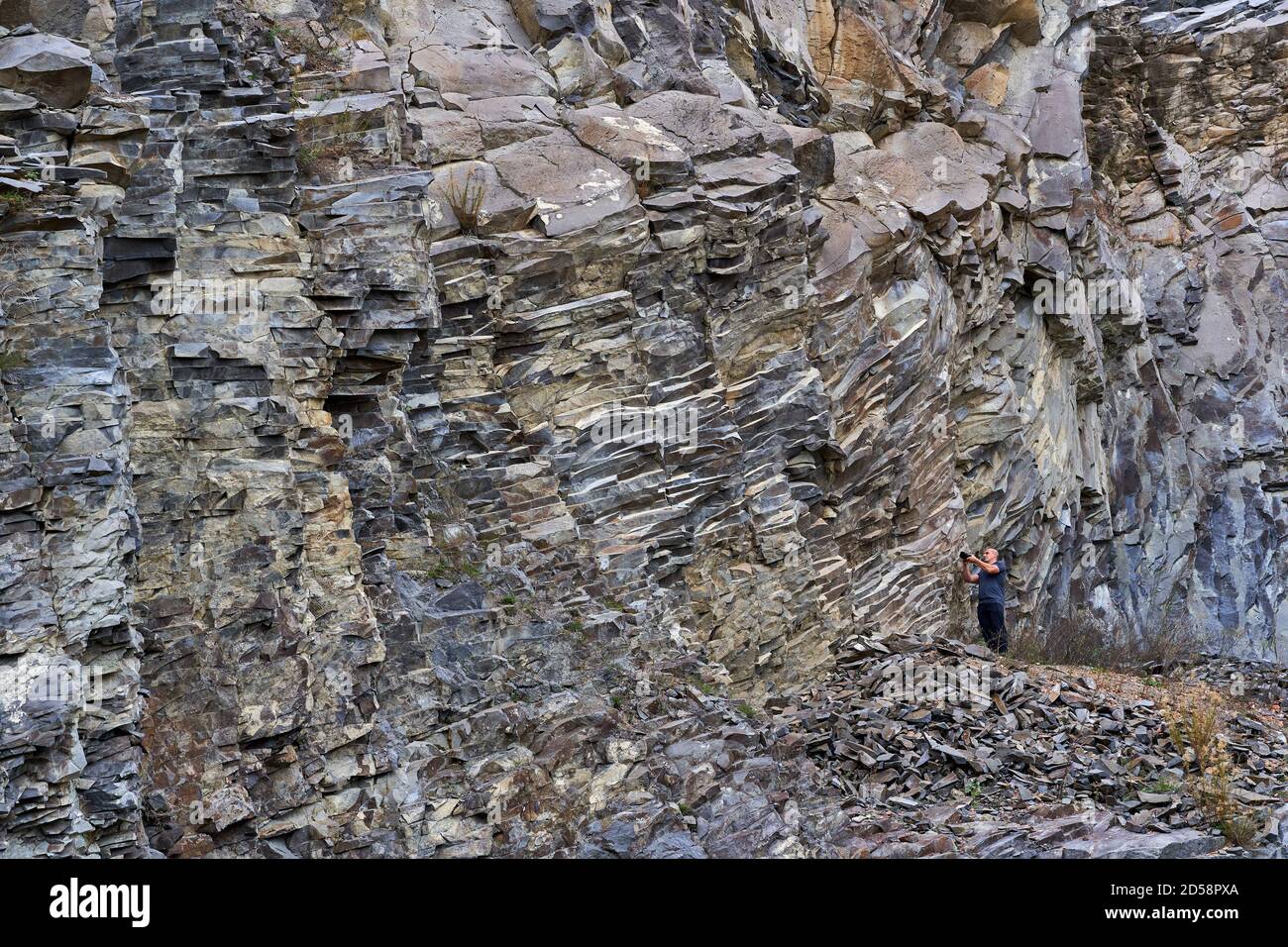 Various rock formation in geological layers in an abandoned quarry ...