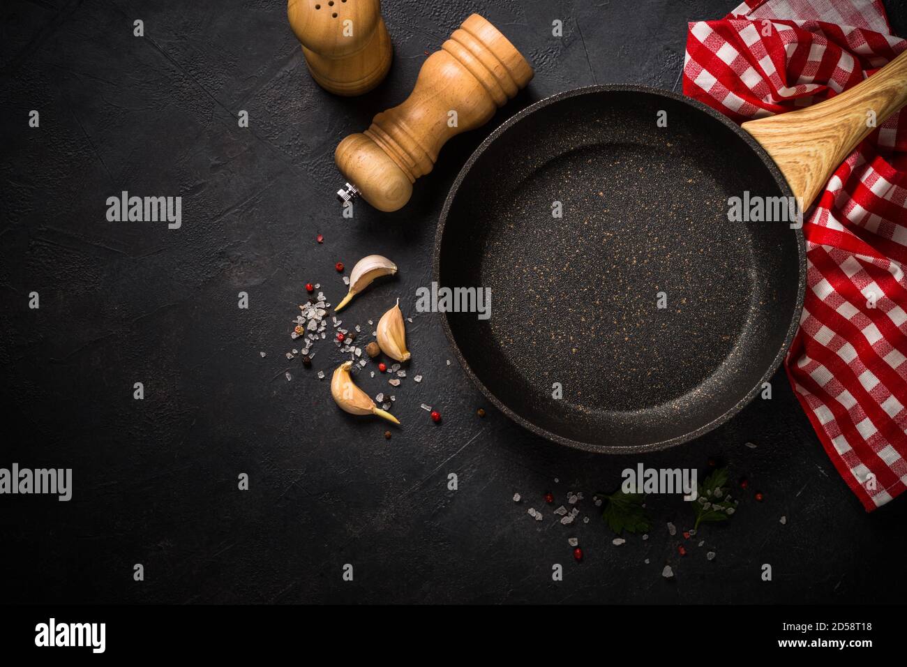Food cooking background on black table Stock Photo - Alamy