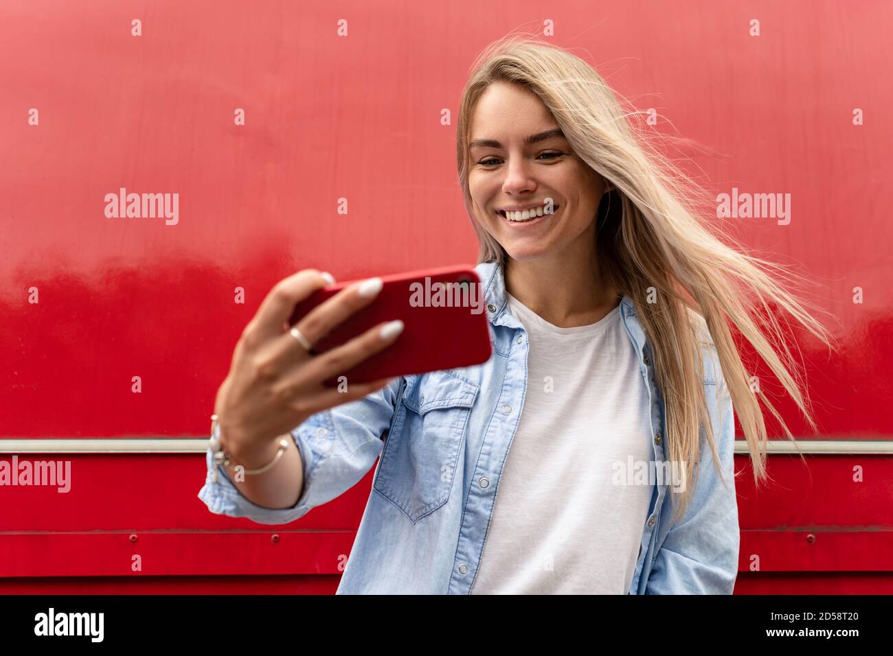 Portrait of a beautiful woman taking a selfie Stock Photo - Alamy