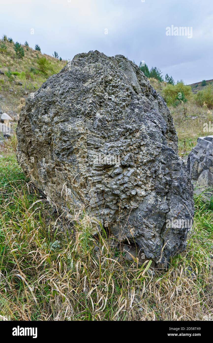 Various rock formation in geological layers in an abandoned quarry ...