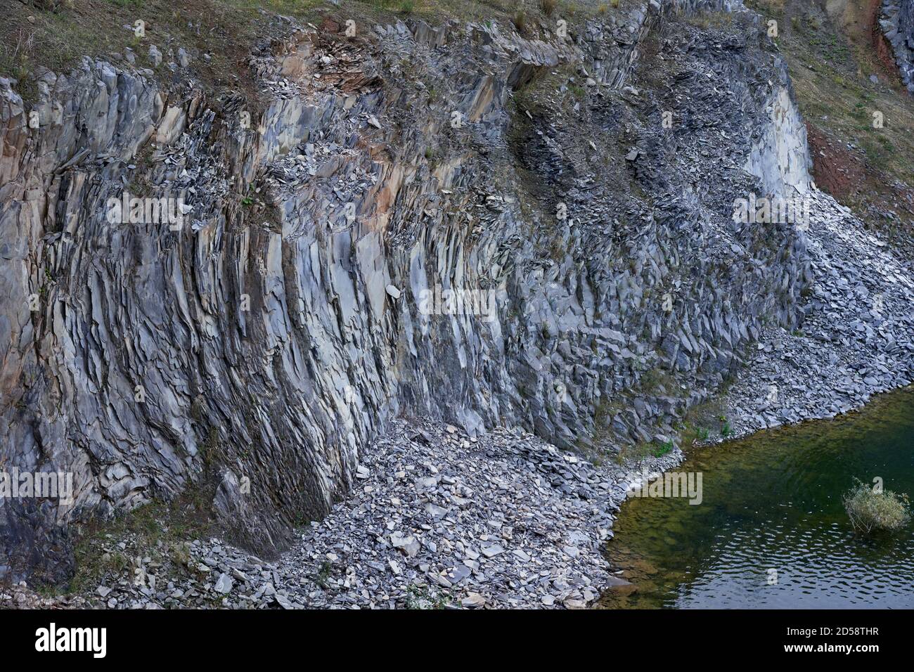 Various rock formation in geological layers in an abandoned quarry ...