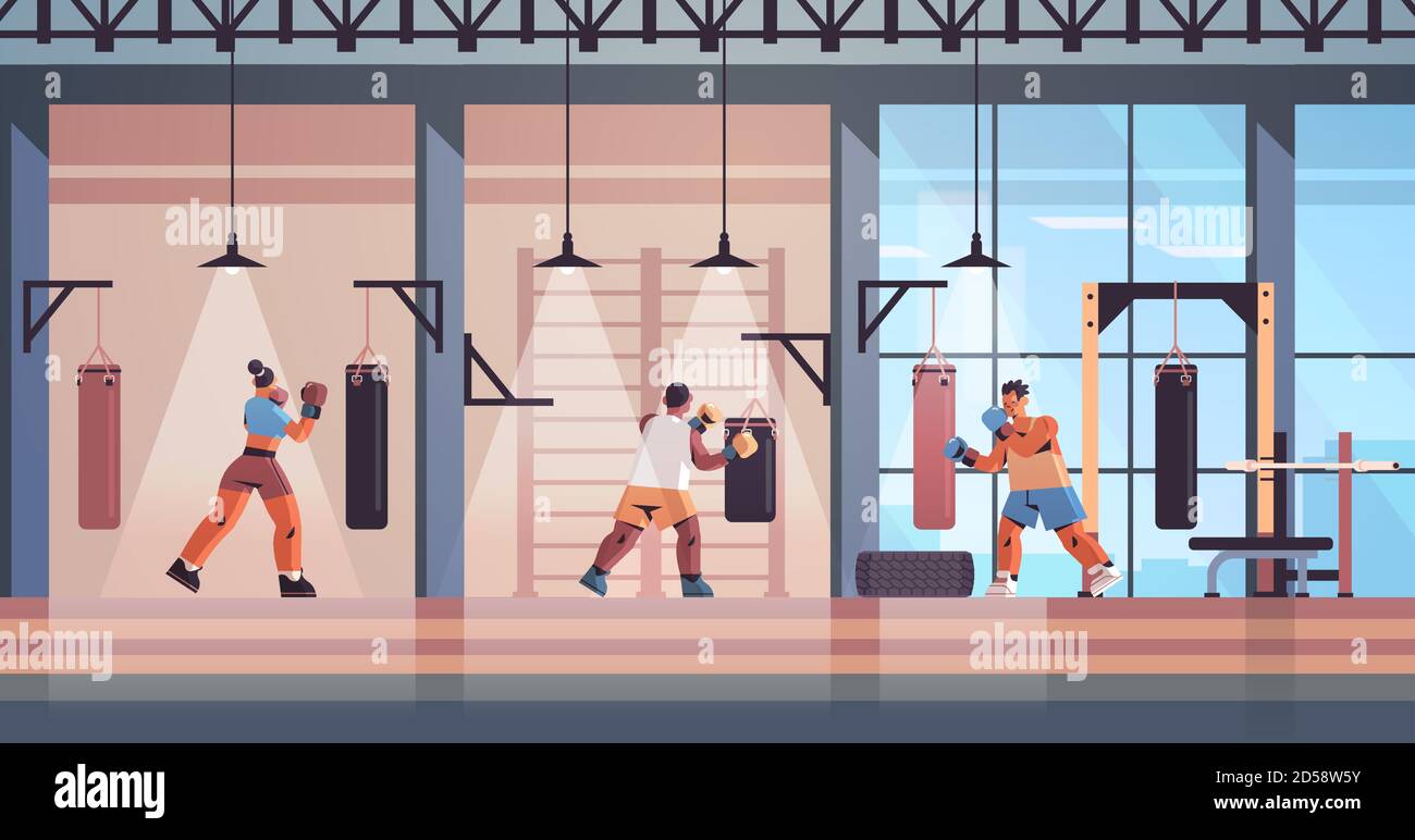 mix race boxers doing exercises with punching bag training healthy ...