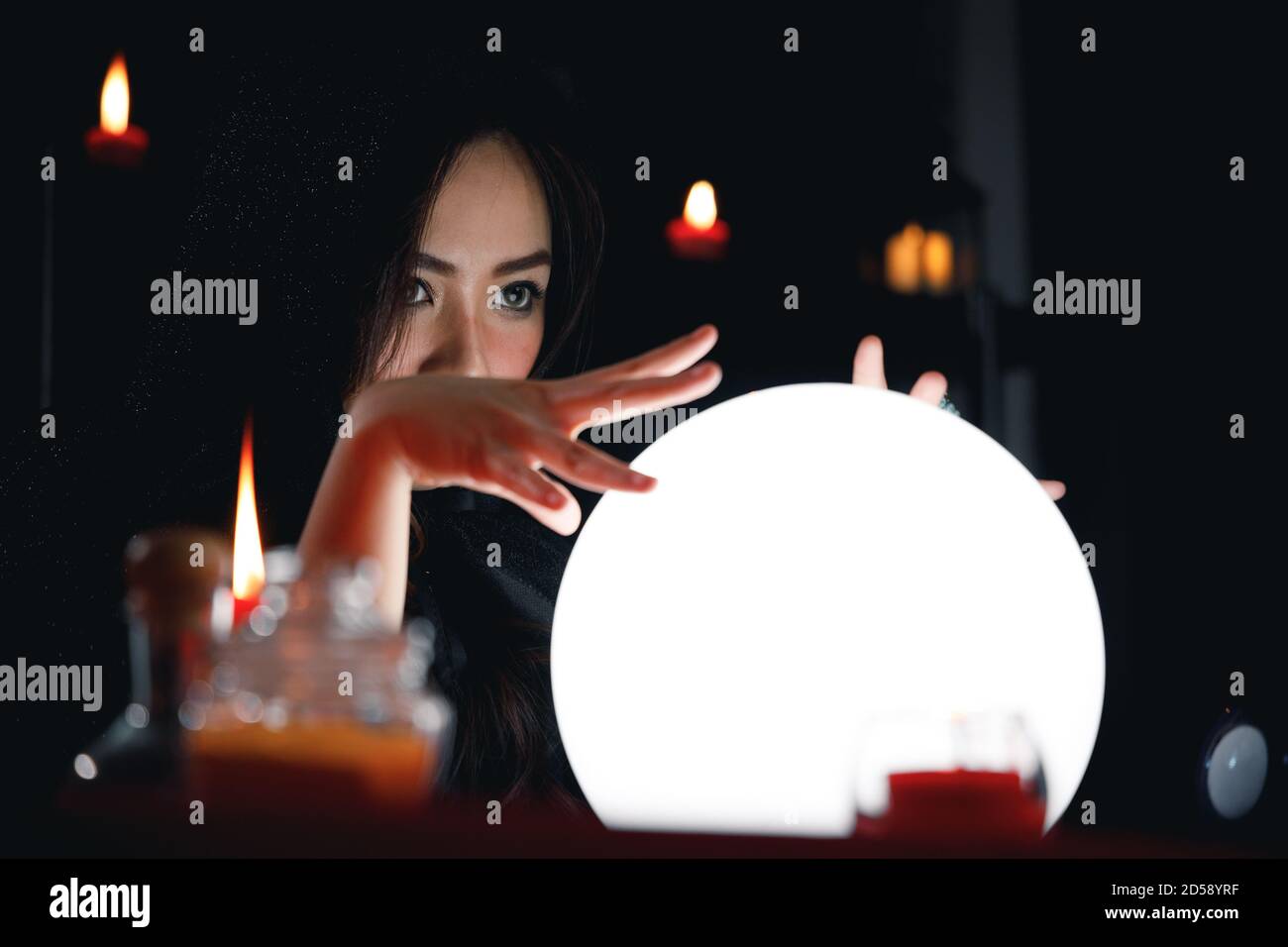 Fortune teller in black hood forecast future event or destiny by using ...