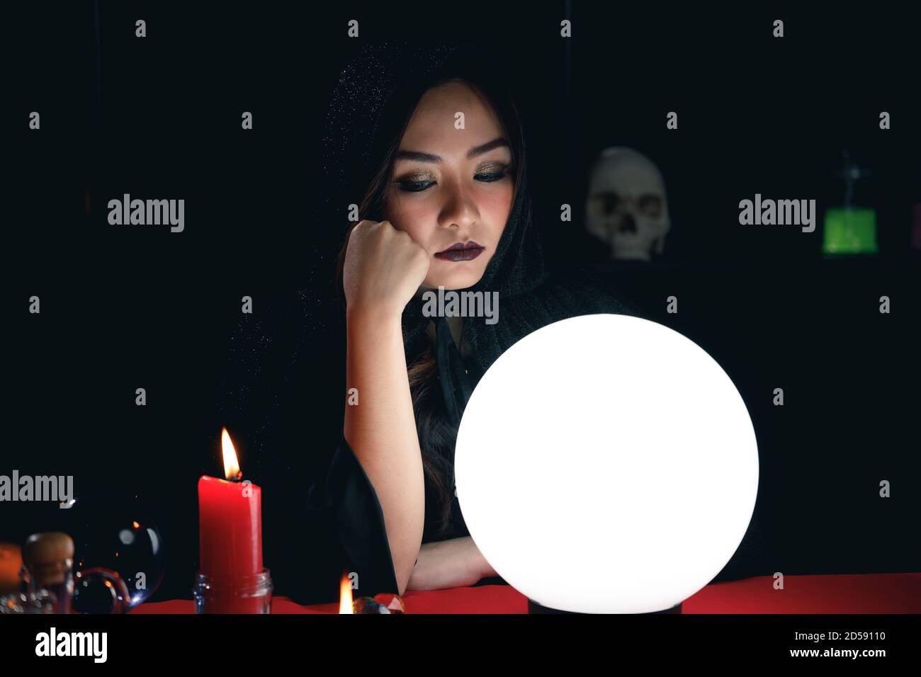 Fortune teller in black hood forecast future event or destiny by using ...