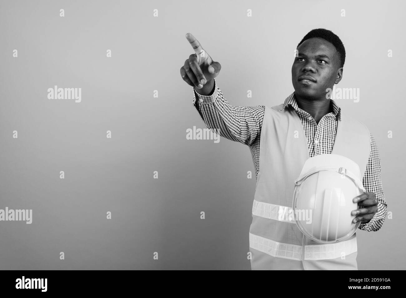 Young African man construction worker against white background Stock ...