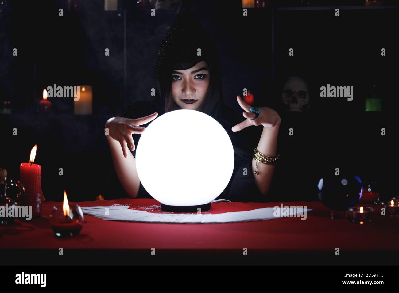 Fortune teller in black hood forecast future event or destiny by using ...