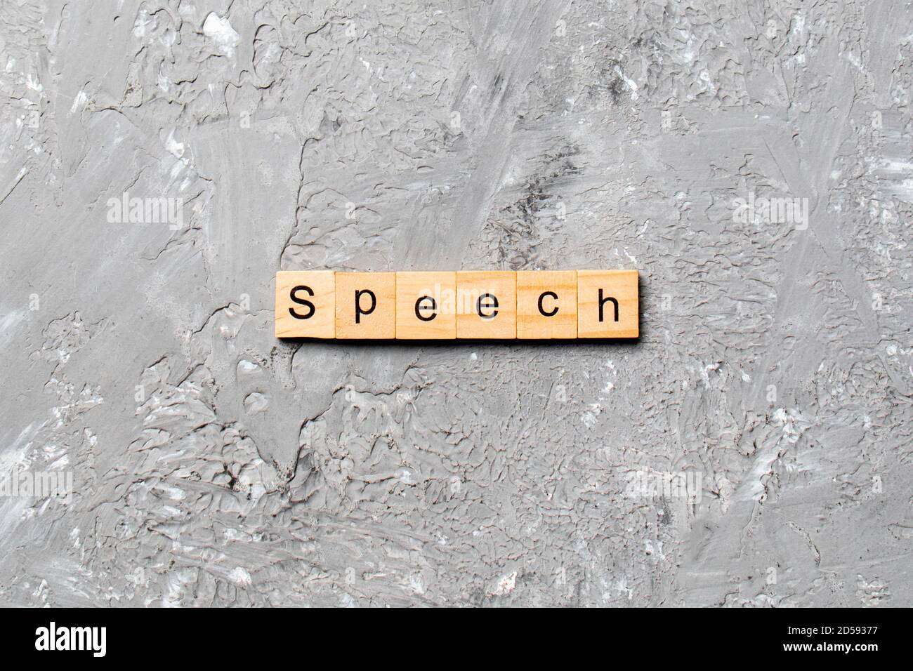 speech word written on wood block. speech text on cement table for your ...