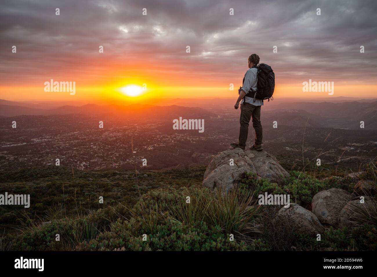 Hiker standing mountain sky sunset adventure hi-res stock photography ...