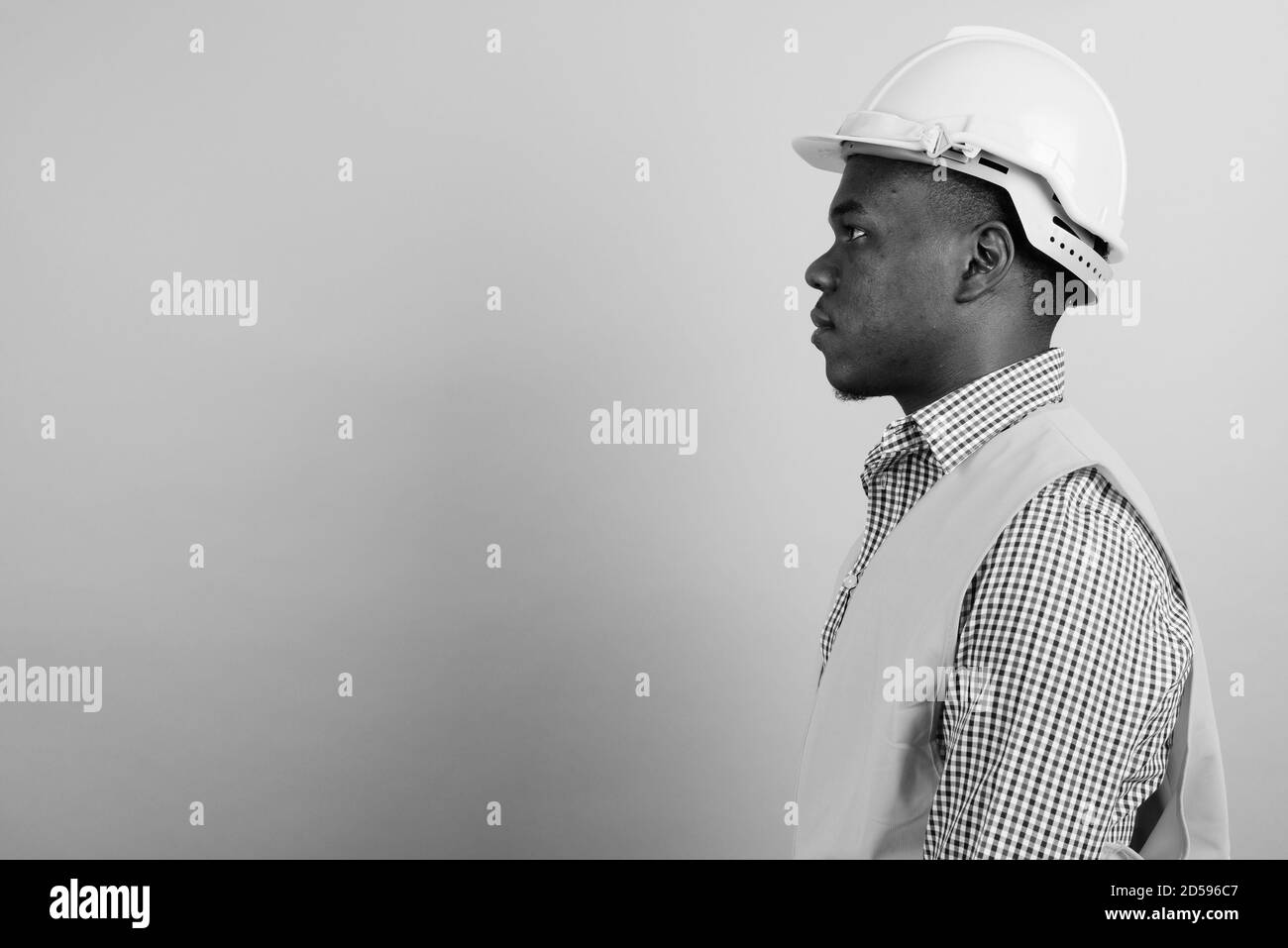 Young African man construction worker against white background Stock ...