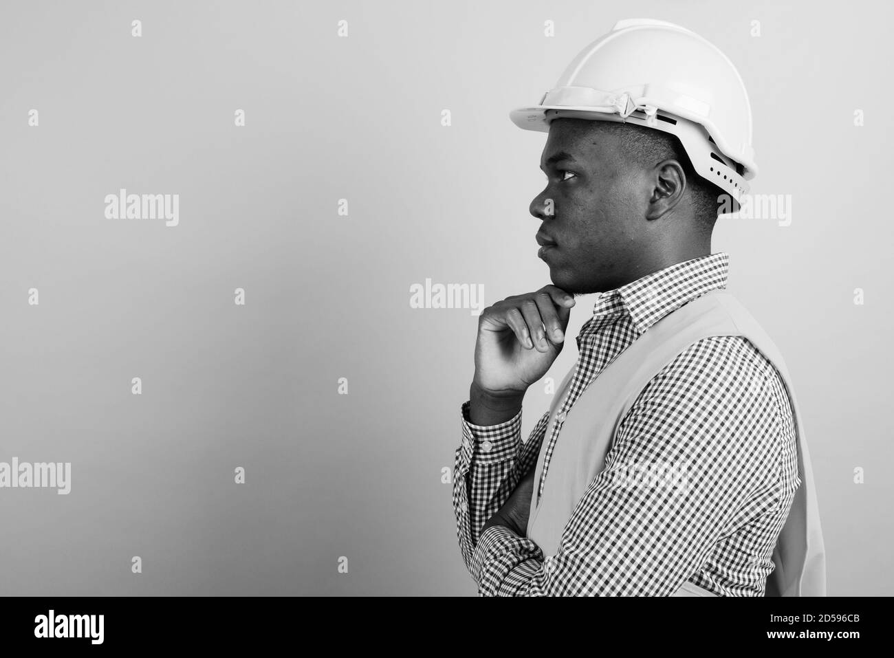 Young African man construction worker against white background Stock ...