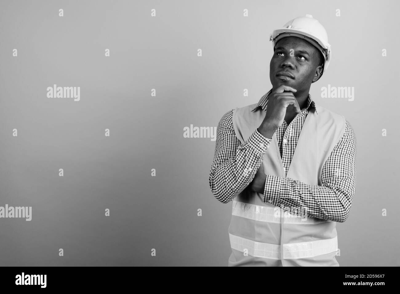 Young African man construction worker against white background Stock ...