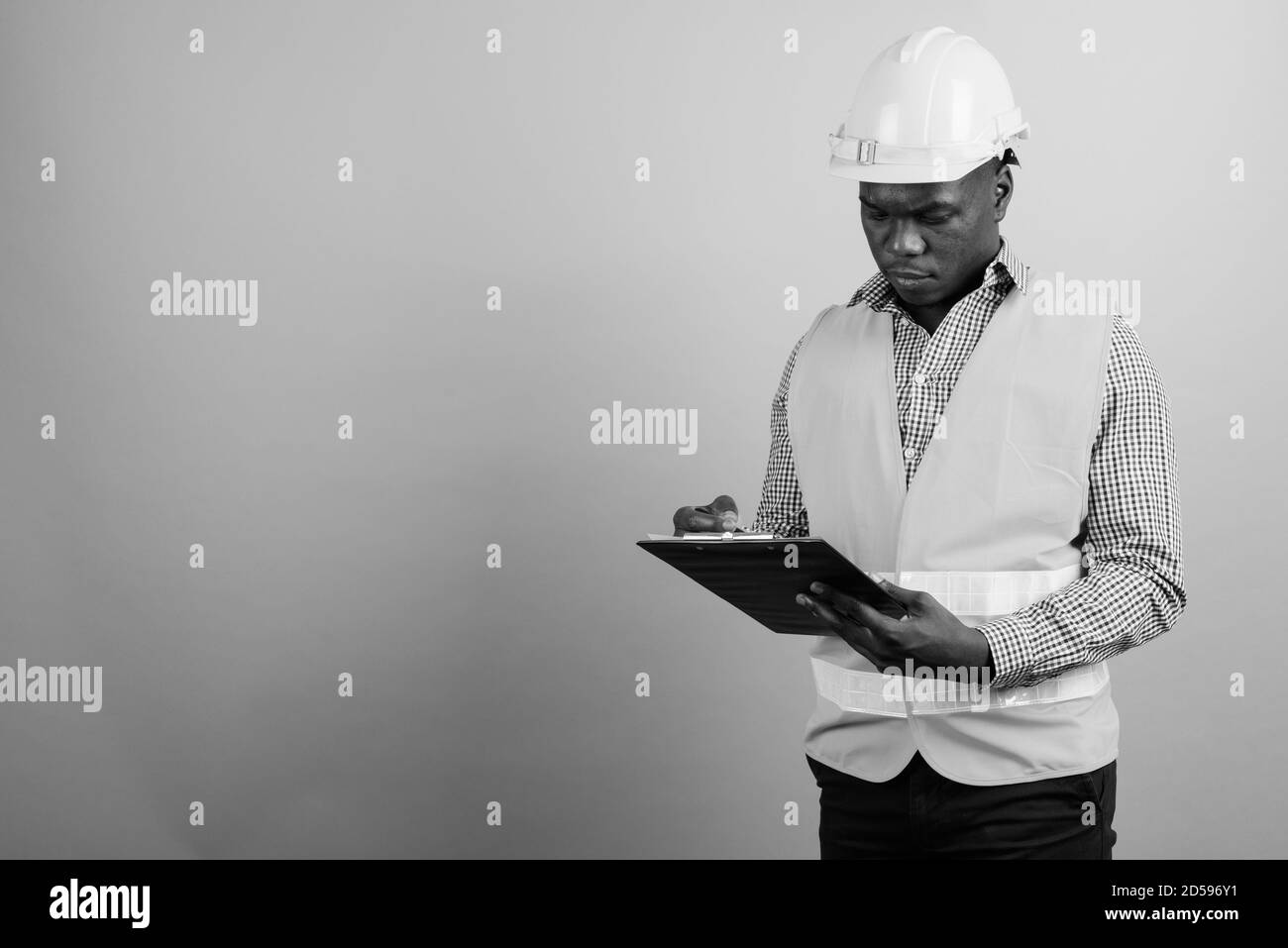 Young African man construction worker against white background Stock ...