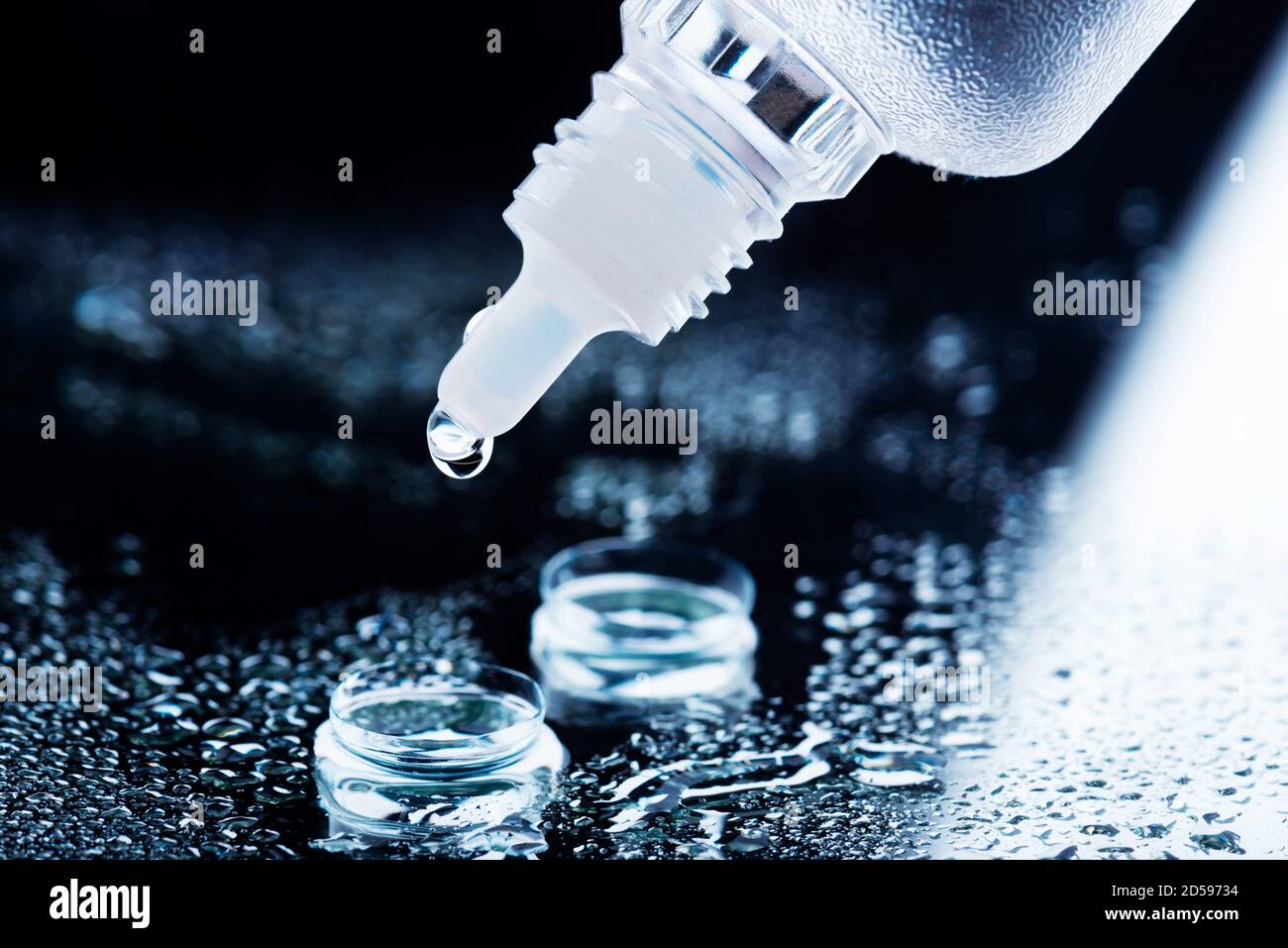 Bottle with lens solution. Contact Lens Care Stock Photo - Alamy