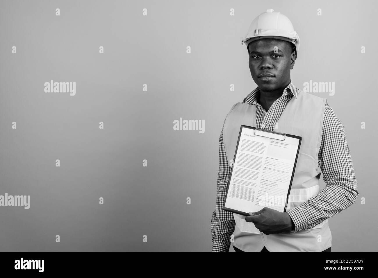 Young African man construction worker against white background Stock ...