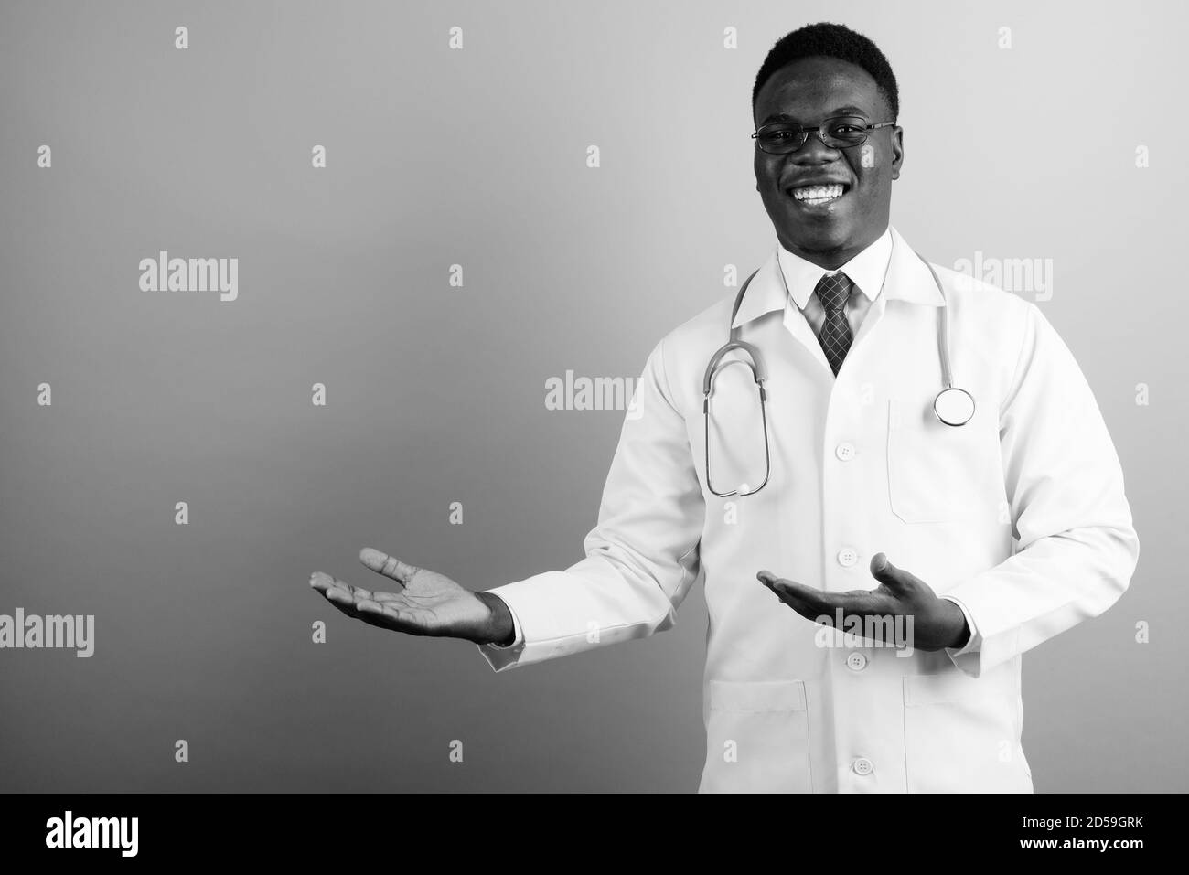 Medical doctor man happy showing Black and White Stock Photos & Images ...