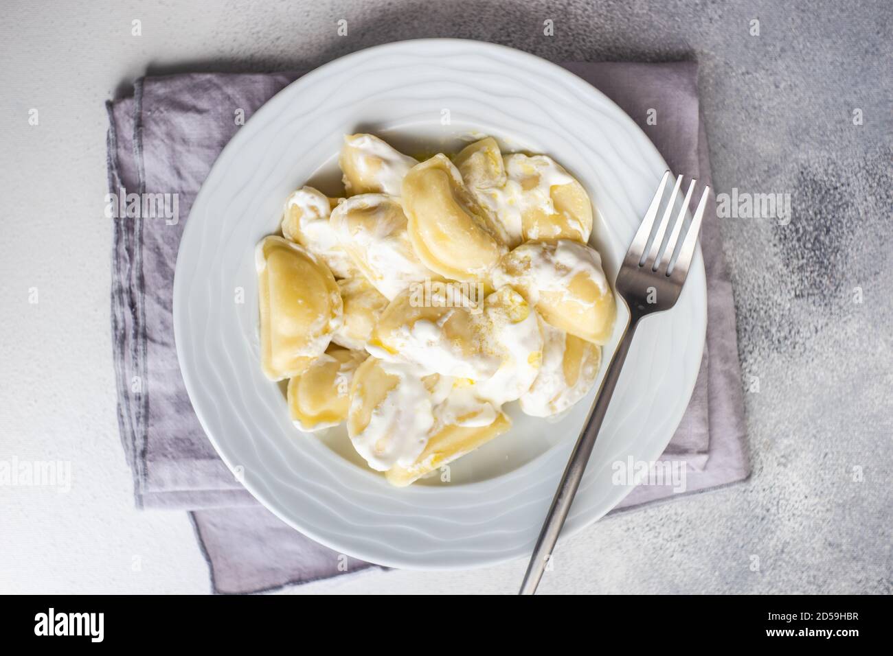 Traditional Ukrainian vareniki potato dumplings with sour cream Stock ...