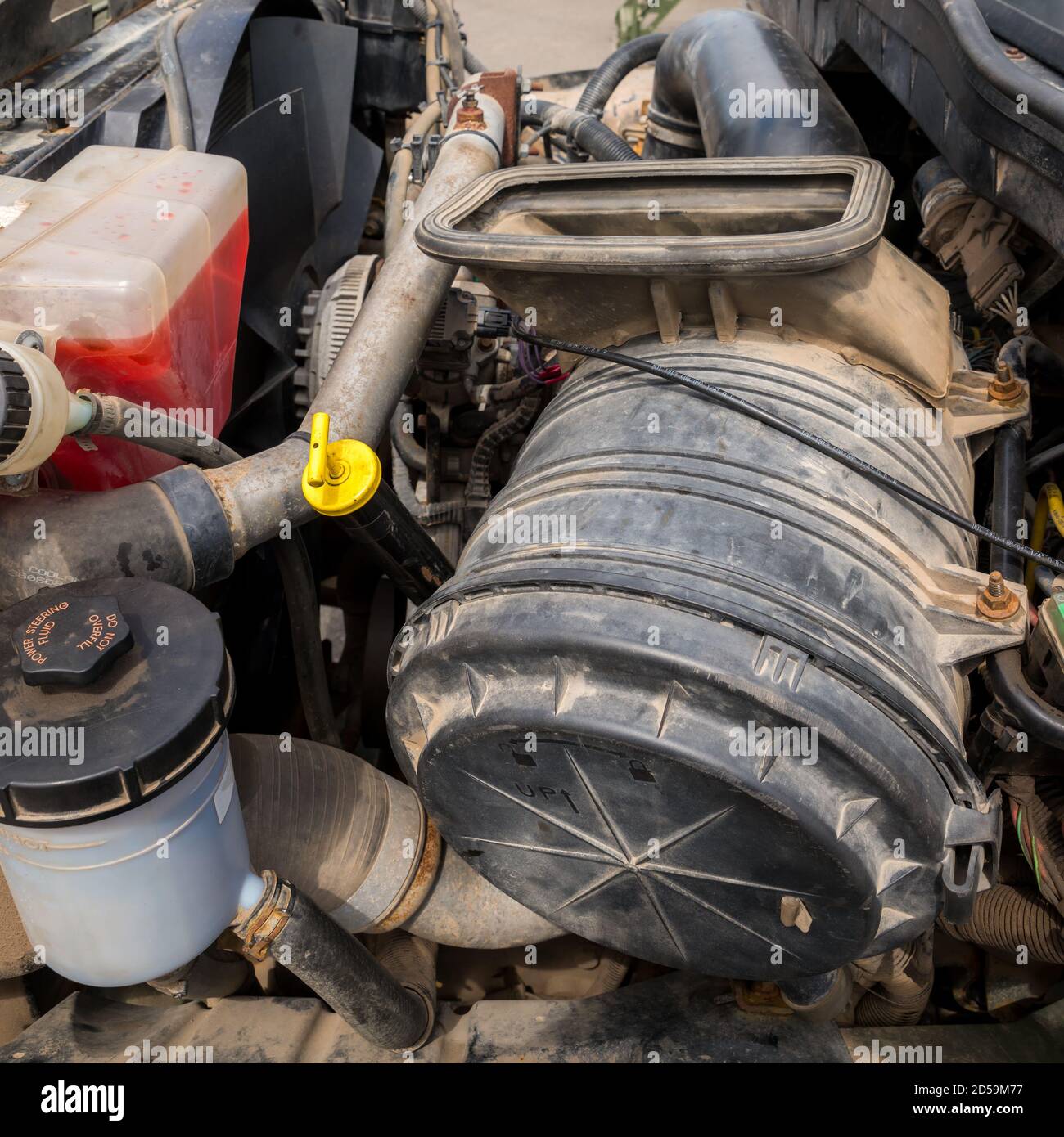 Closeup view under the hood of a military truck.Engine and components ...