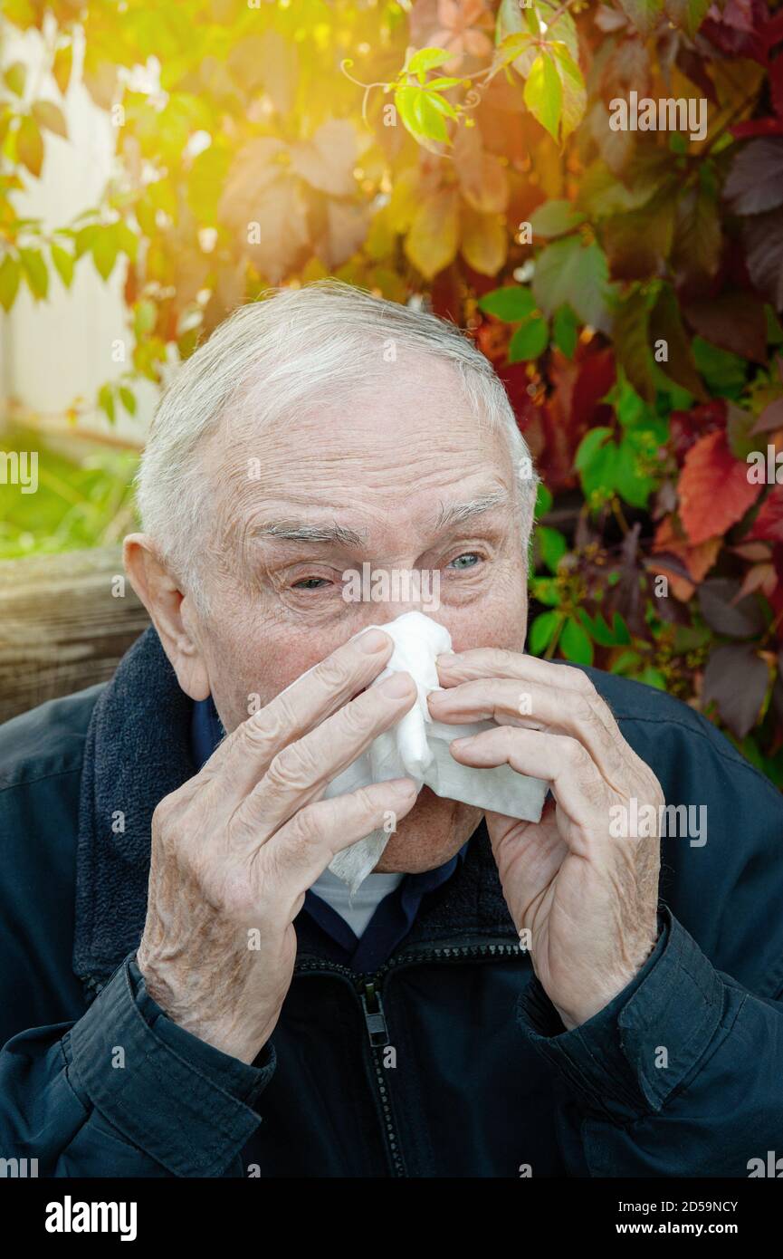 old man wipes his tears with a handkerchief. Upset distressed sick old ...
