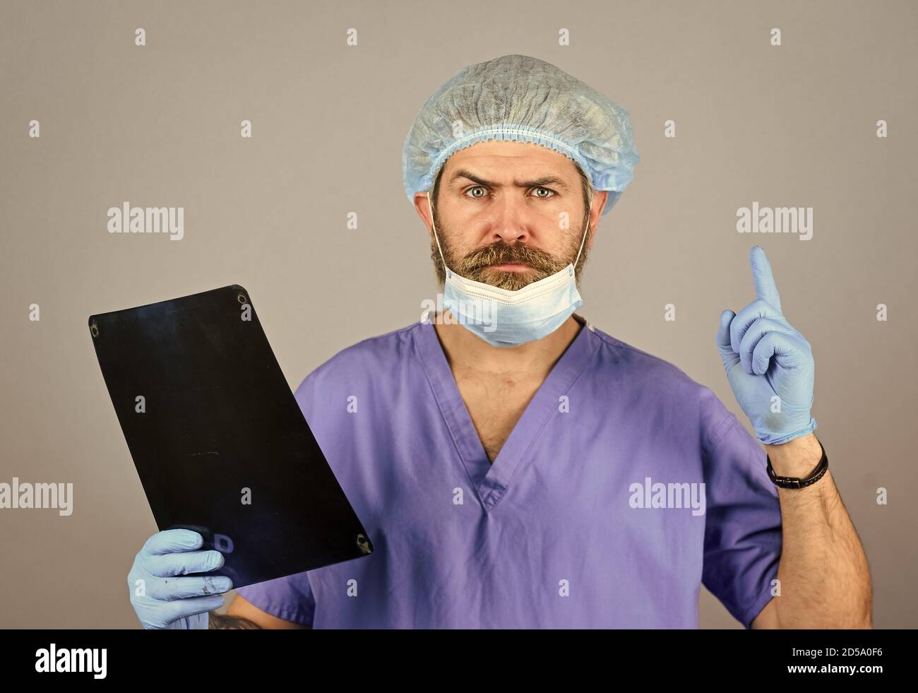 diagnose patient injury. man look at roentgen. Radiologist hold xray ...