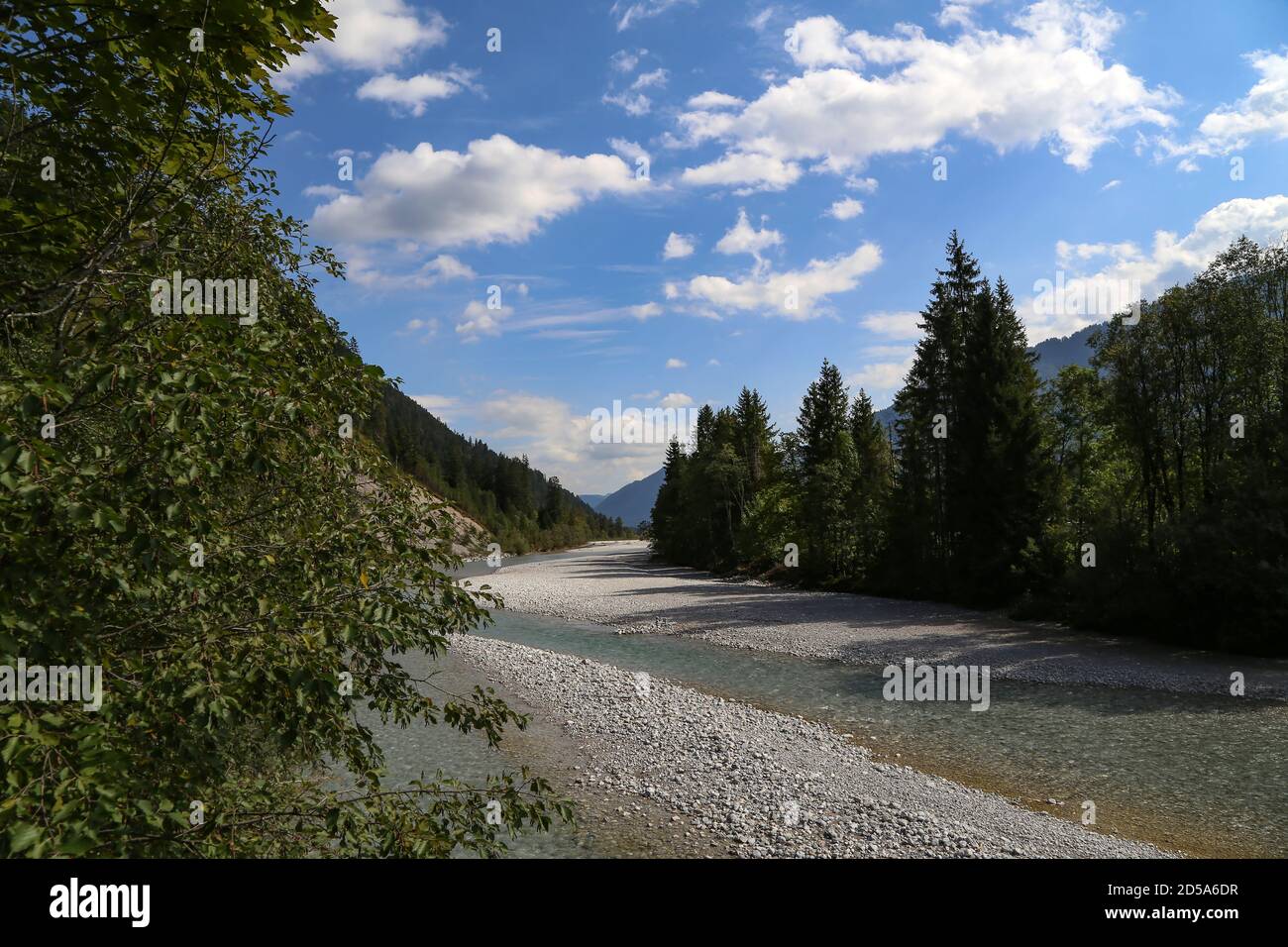Mountain landscape with a small river in the Alps Stock Photo - Alamy