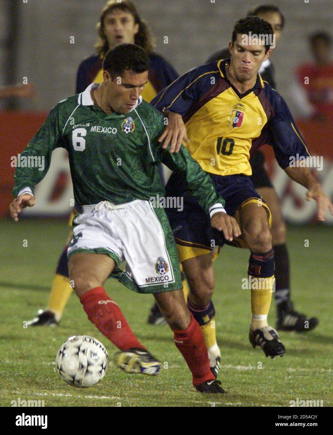Mexico's Raul Lara (L) and Venezuela's Gabriel Urdaneta fight for the ...