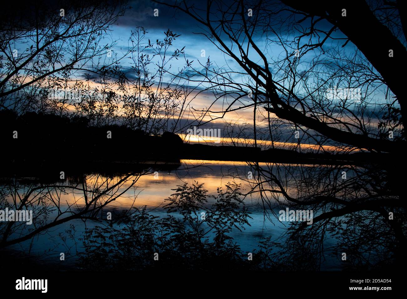 sunset at the river Stock Photo - Alamy