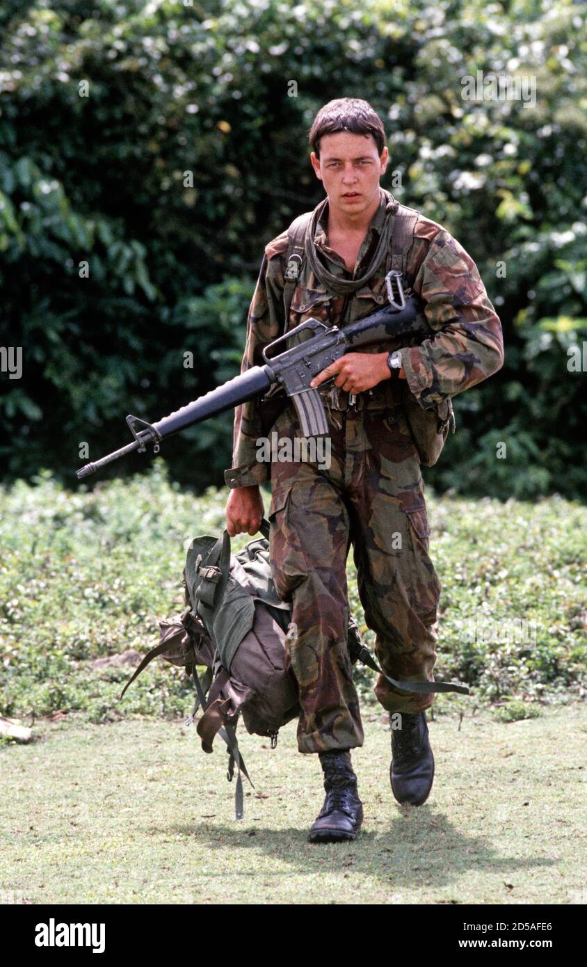 British Army soldier waiting to board Royal Air Force helicopter during ...